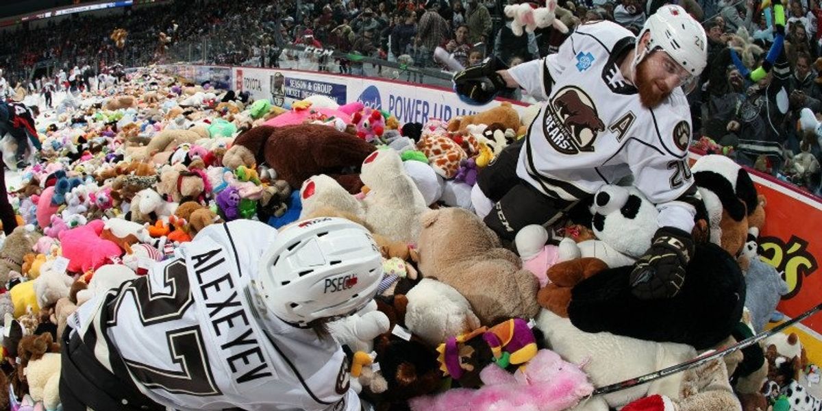 Watch as over 45,000 stuffed animals are thrown onto the ice in a ...