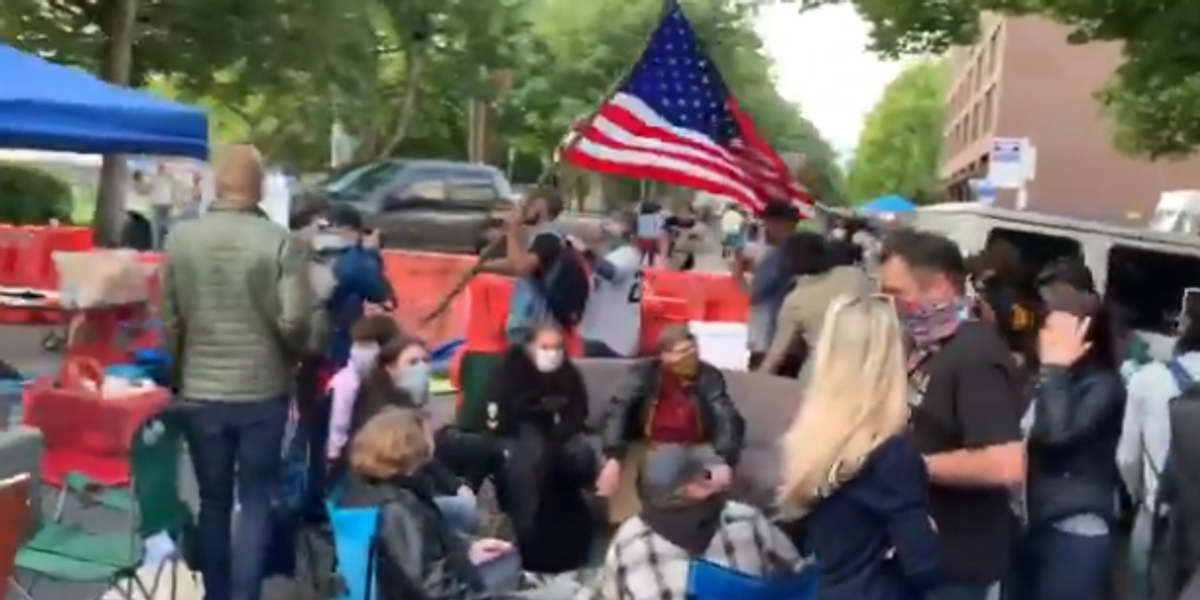 CHAZ Video: Black man with American flag chased out of autonomous zone ...