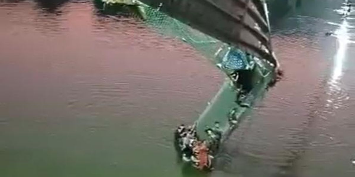 Men seen in CCTV footage violently shaking Indian suspension bridge moments before its horrific ...