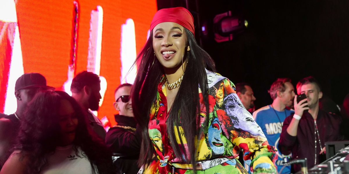 Cardi B Wore a Blanket With Her Face On It to the Airport - PAPER Magazine