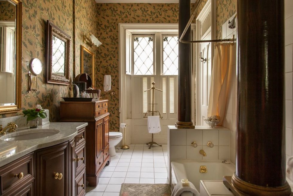 This Gothic Revival inn looks like something from a magazine and it's ...