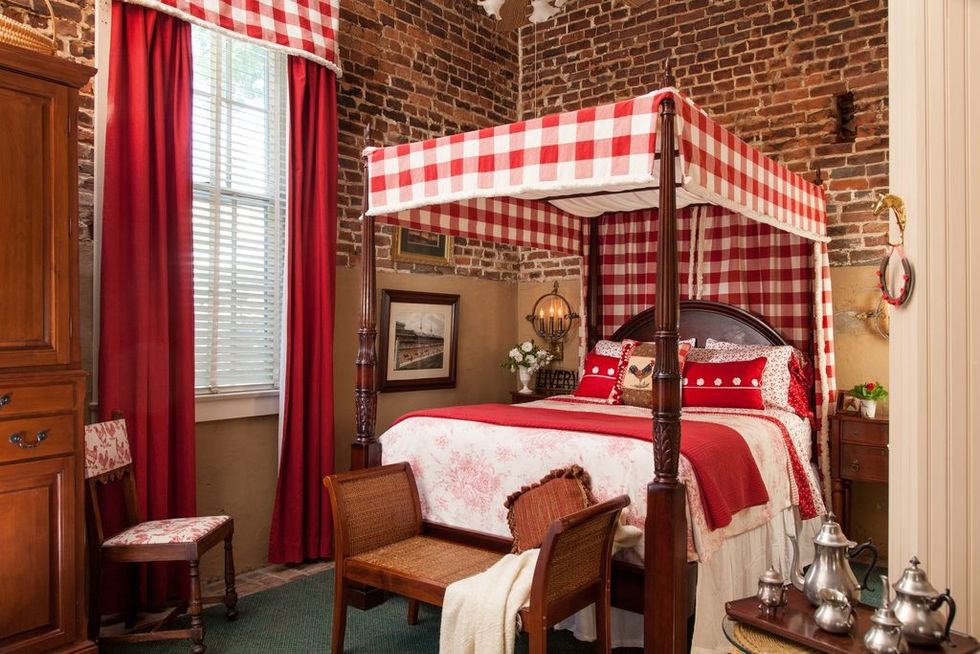 This Gothic Revival inn looks like something from a magazine and it's ...