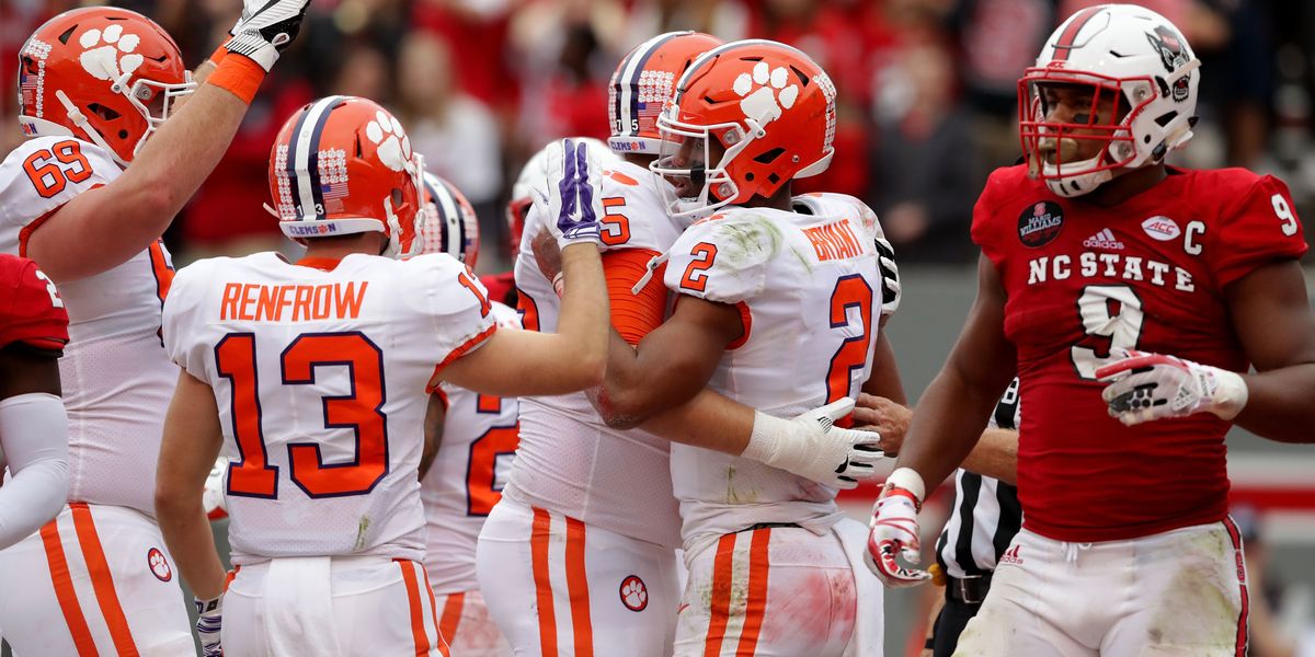 NC State player helps Clemson fan down onto field to celebrate his team ...