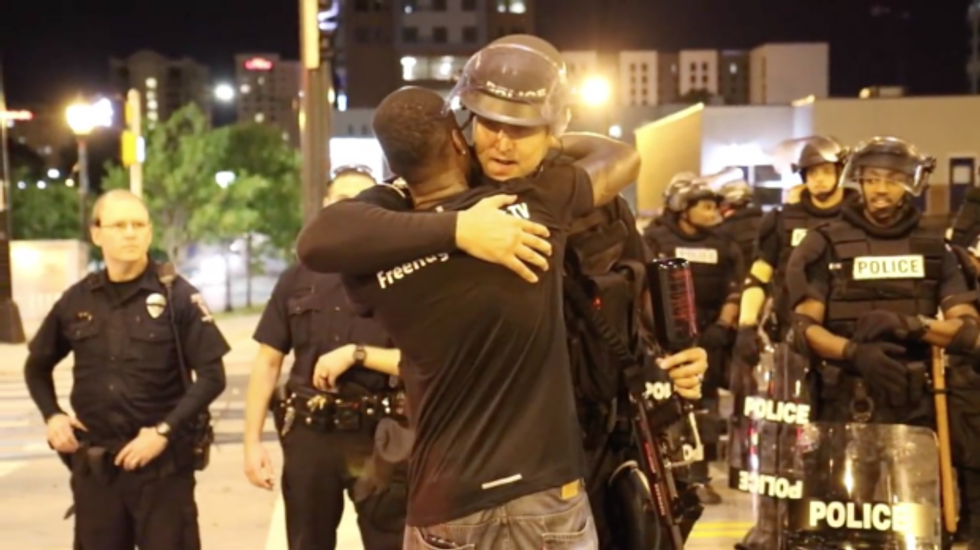 Protesters accost black man as he hugs Charlotte police officers - TheBlaze