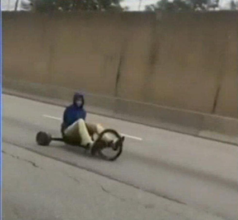 Smiling man caught on video riding big wheel on busy Philly highway ...