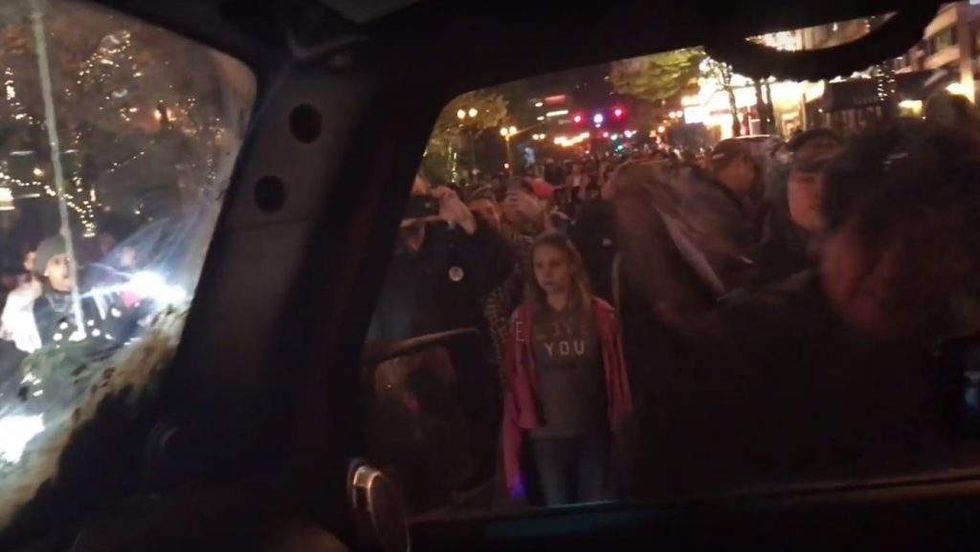 Surrounding protesters start smashing up your car. You fear for your ...