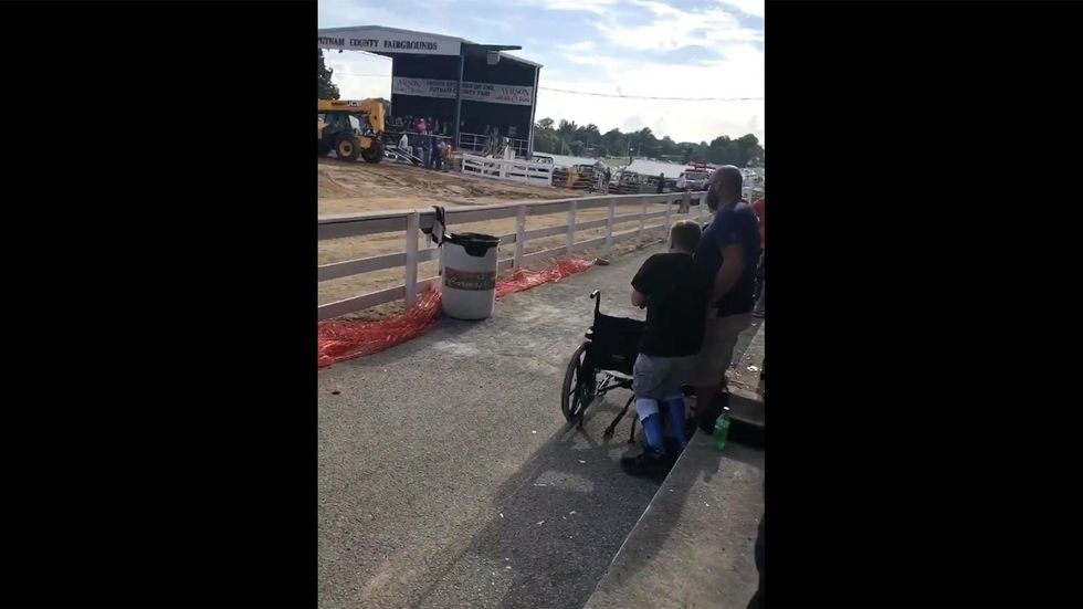 Viral video shows wheelchair-bound boy stand for national anthem at ...
