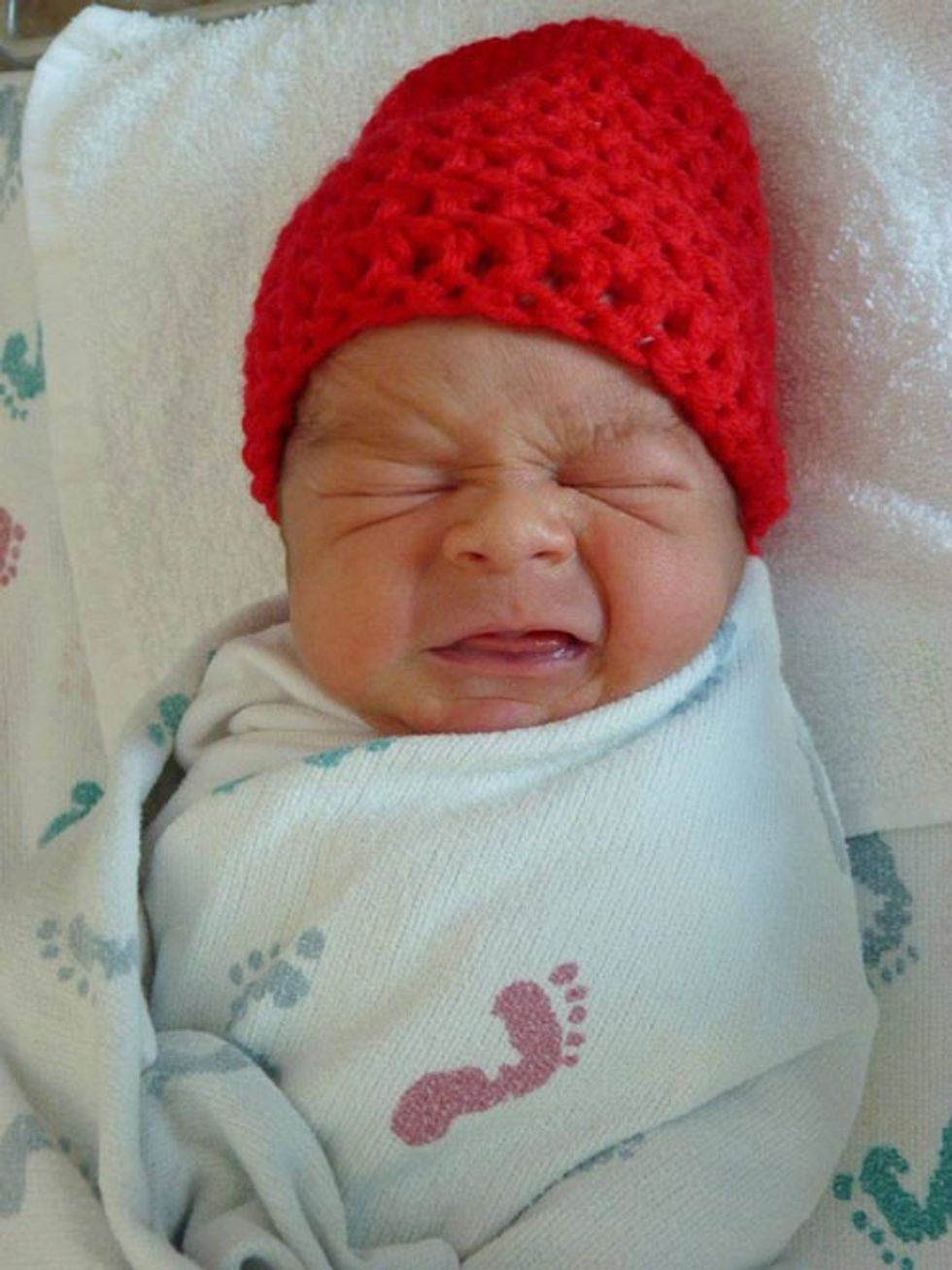 Mom makes red hats for newborns to help raise awareness of what ...