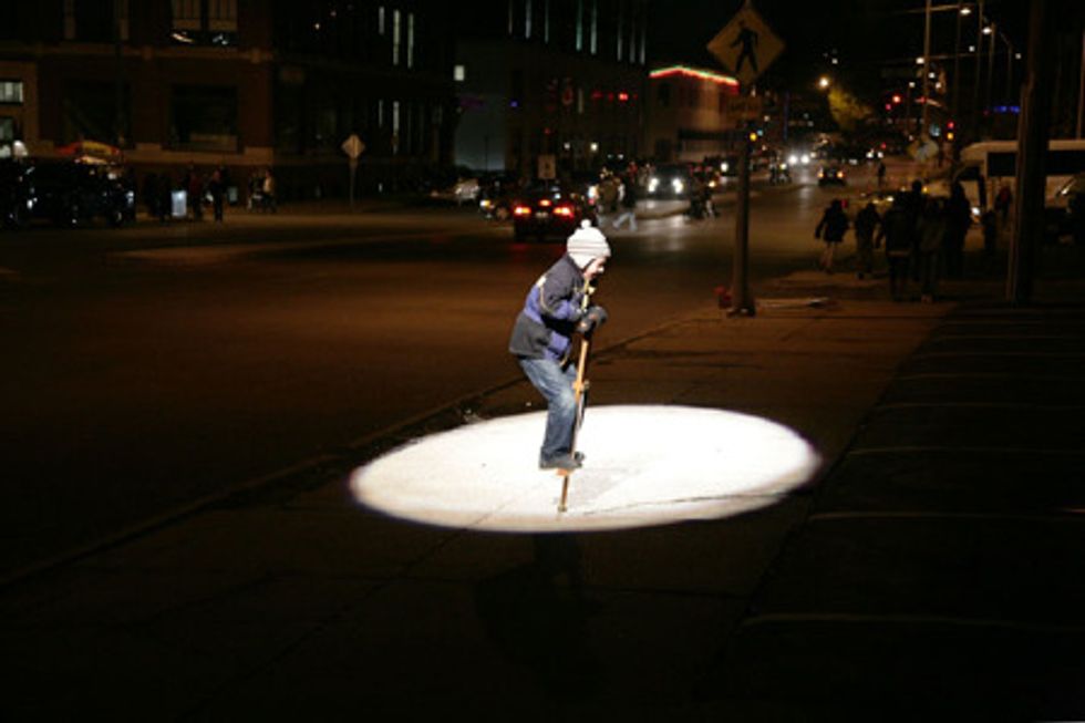 A Simple Spotlight Turns a Street Into Impromptu Performance Space - GOOD
