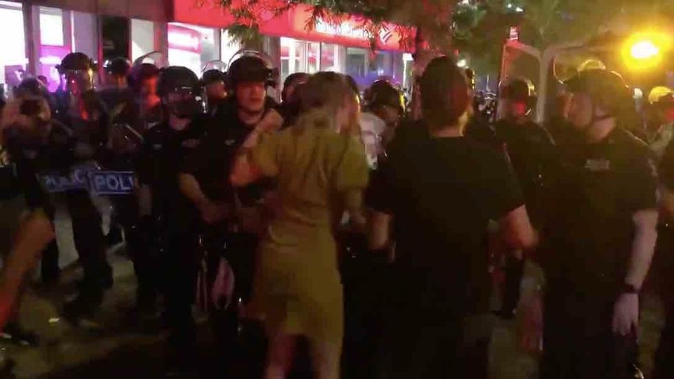 NYPD cop orders screaming leftist to 'back up!' She screams, 'or f ...