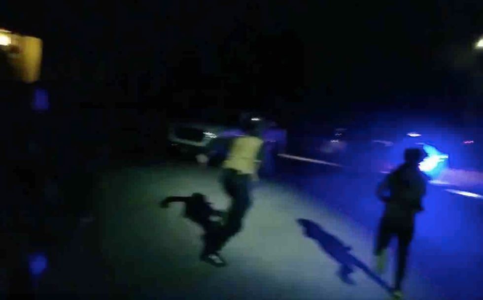 VIDEO: Cop drives motorcycle into protester blocking his path, pushing ...