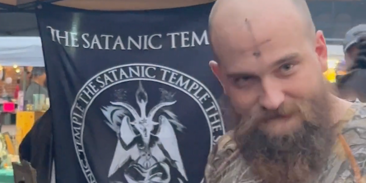 Video: People get inverted cross symbols on foreheads, recite 'Hail ...