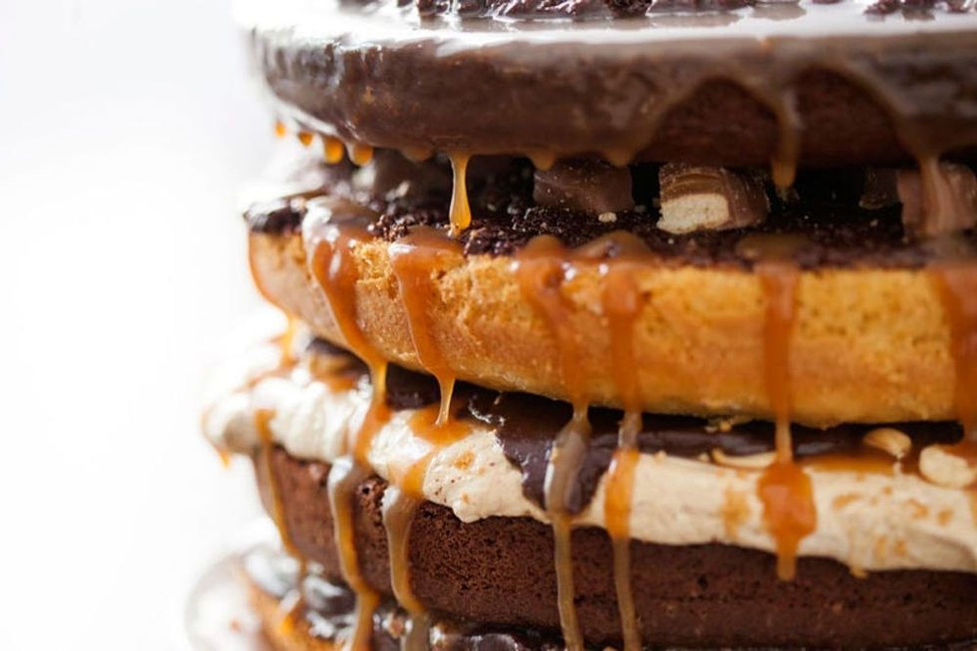 Introducing Our Candy Bar Cake! Four Layers of Twix, Snickers, Heath ...