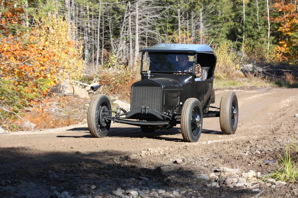 Variety of vintage vehicles volley up very gravely valleyside - Hemmings