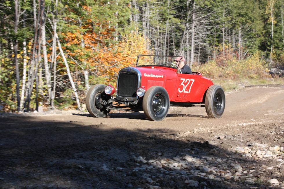 Variety of vintage vehicles volley up very gravely valleyside - Hemmings